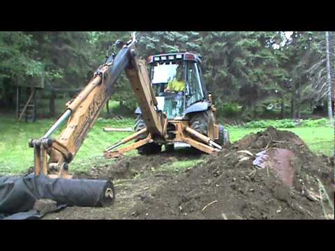 Backhoe Digging A Ditch - YouTube