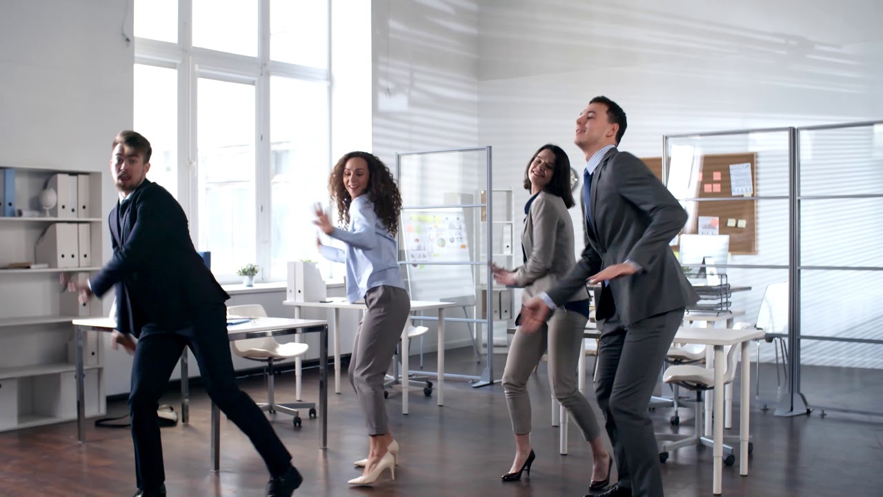 team of young happy colleagues dancing in office H5X6P9J - YouTube