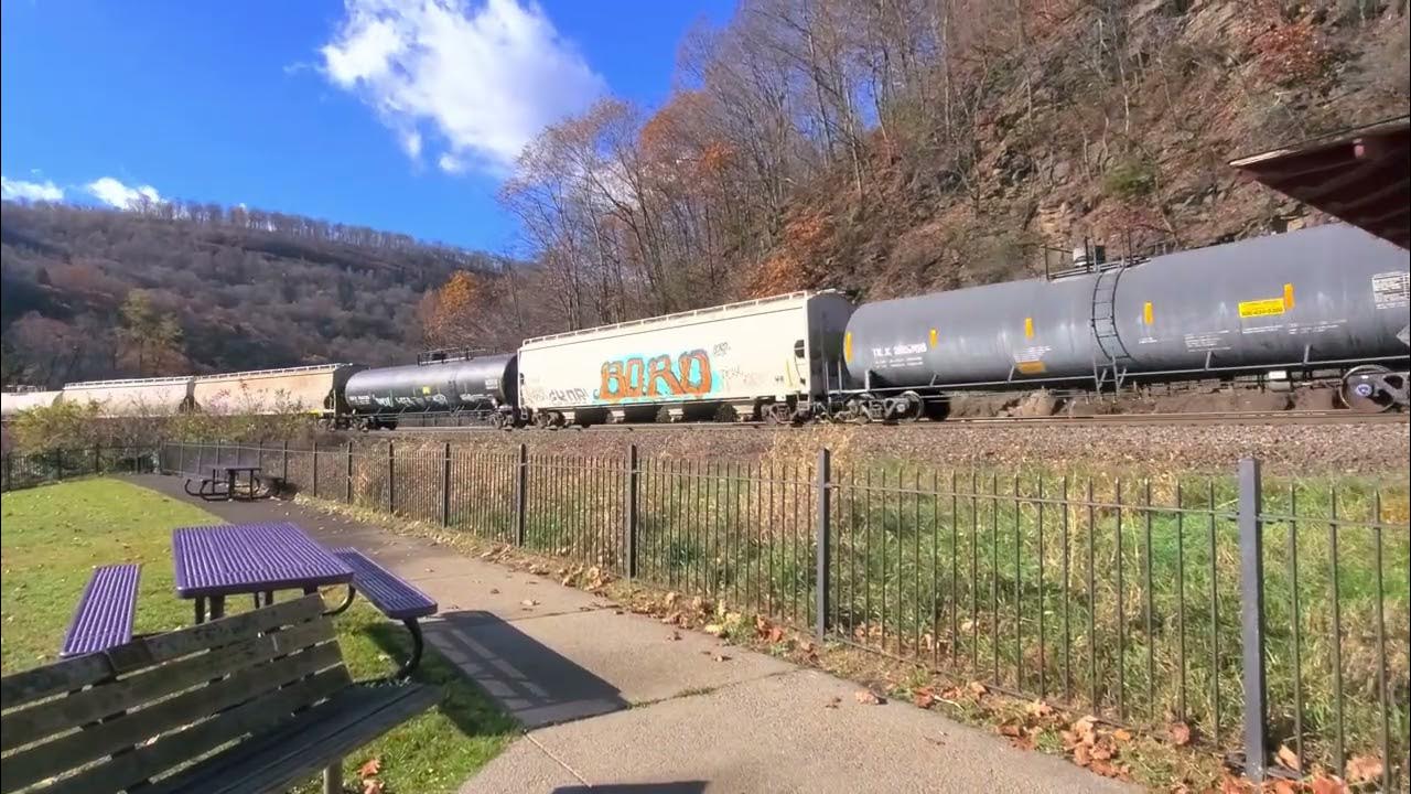NS 4786 & 7254 slowly decend the Horseshoe Curve with the eastbound mixed freight...3 DPU'S ...