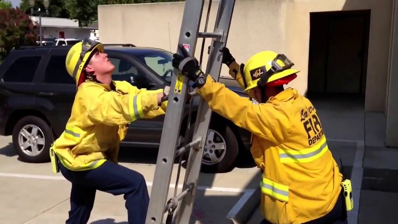 35' ladder 2 person high shoulder carry to a beam raise - YouTube