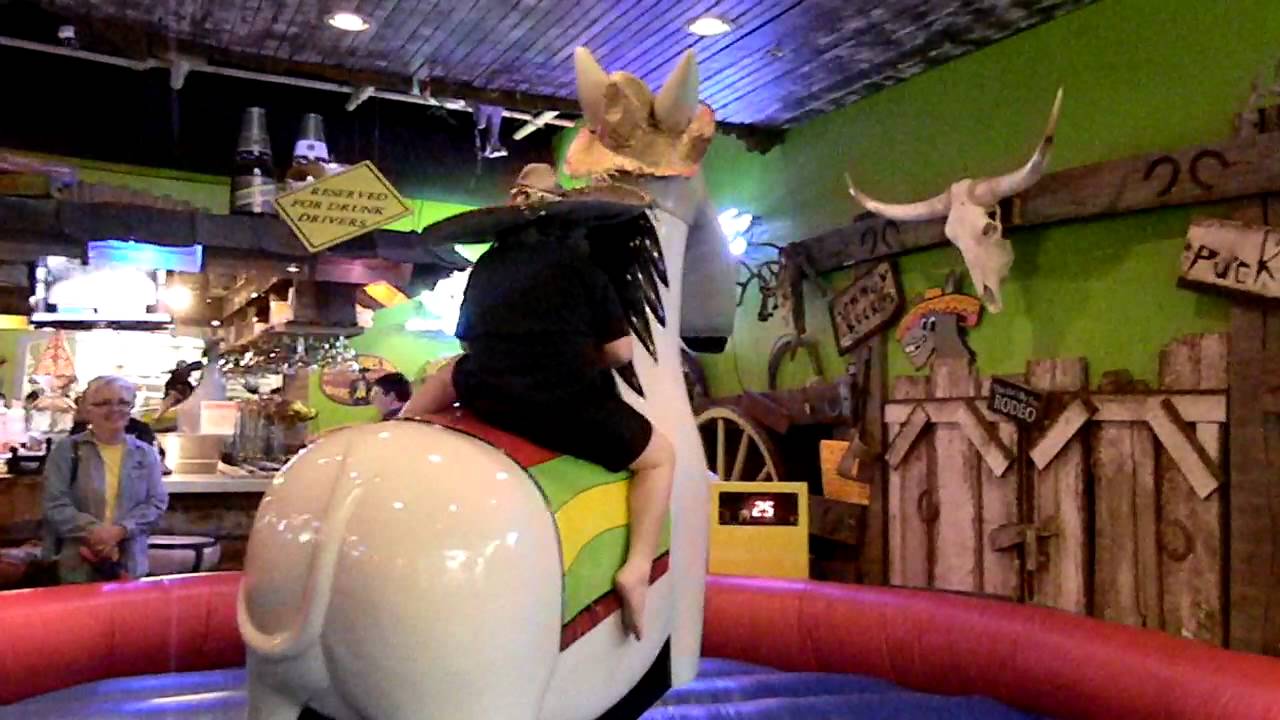 Dominic riding the mechanical donkey at Locco Burro - YouTube