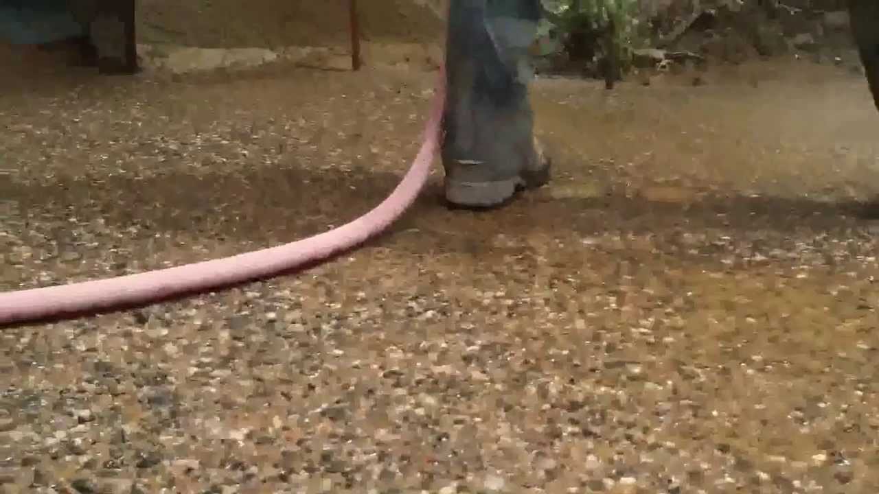 Washing exposed aggregate - YouTube