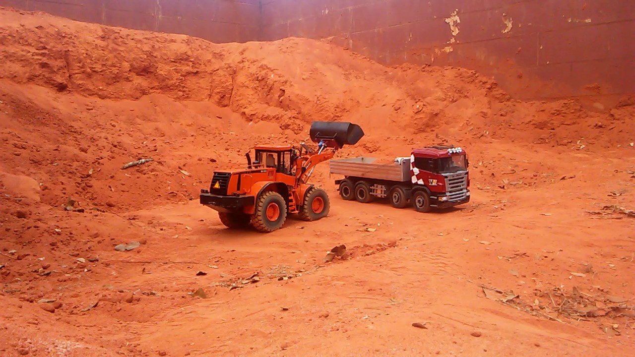 Loading red clay at the mine - YouTube