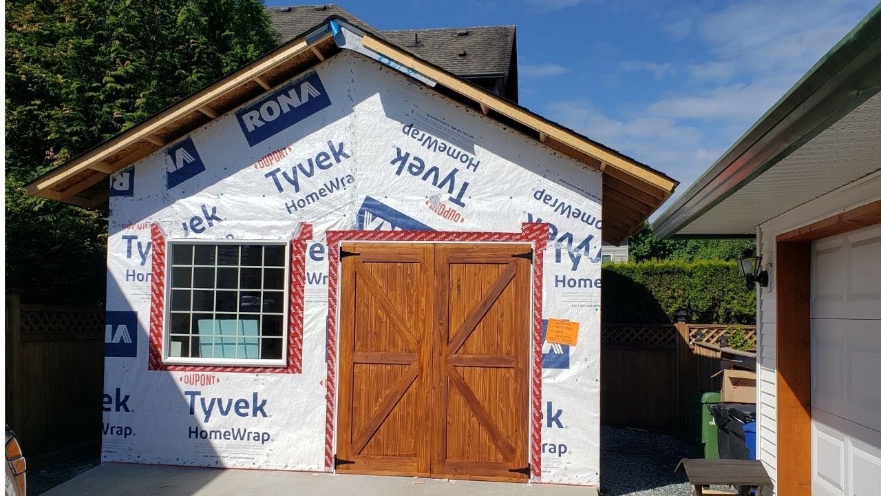 Dream shop build episode 4 - House wrap windows and doors - YouTube
