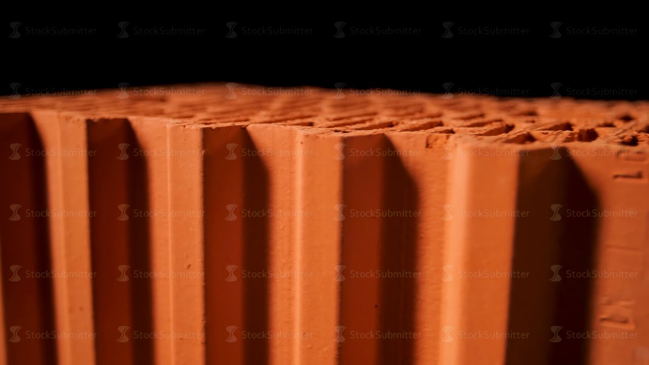 Close up of perforated ceramic blocks with round holes isolated on ...