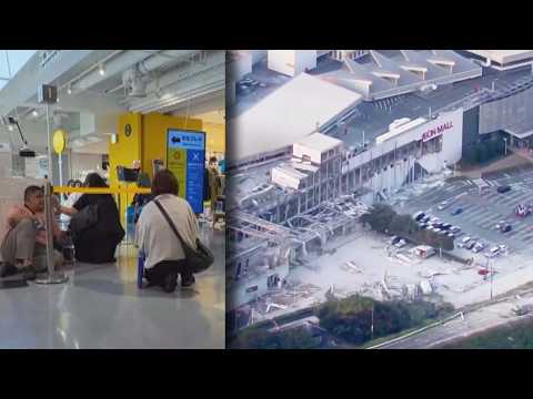 People Huddle For Safety As Powerful Earthquake Shakes Japan