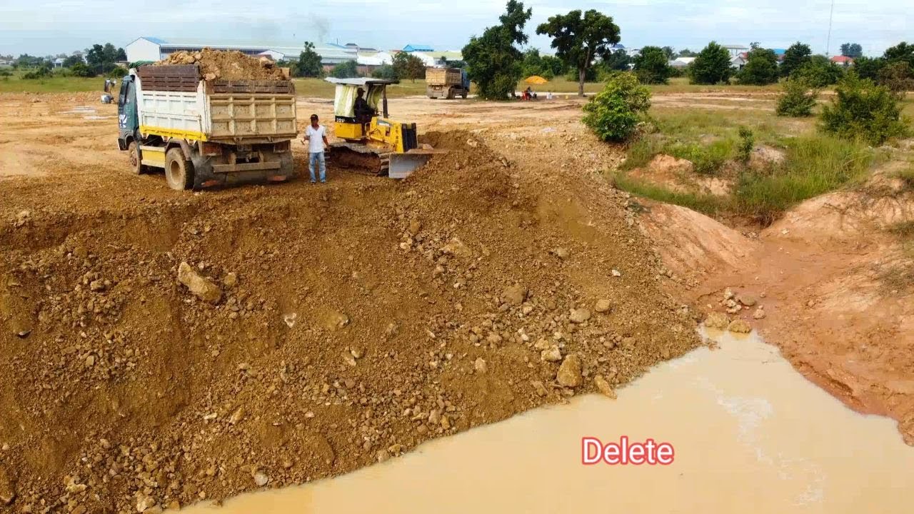 Starting a New project!! Dump truck 5-ton Bulldozer Komatsu push Stone in deep pit delete water ...