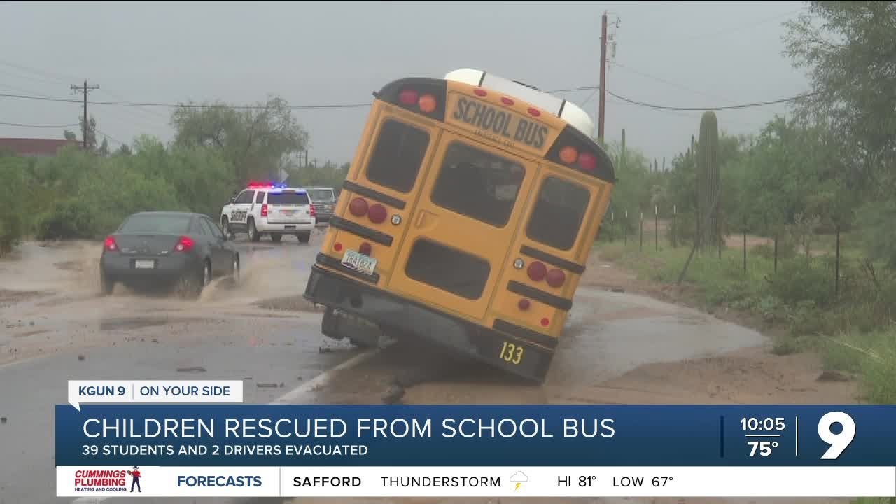Children rescued from school bus in flood water - YouTube