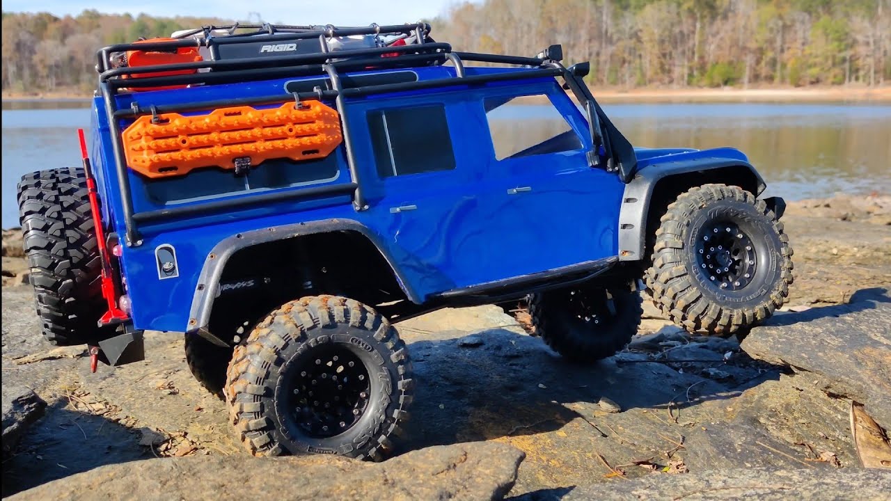 Traxxas TRX4 Land Rover Defender off-road driving on the shoreline. RC ...