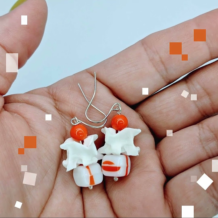 Embrace the Sunshine State with our Python Vertebrae Earrings! ☀️ - YouTube