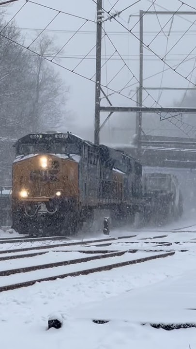 CSX train running through a snow storm with a Mac trailing. #csxtrains #csxrailfanning - YouTube