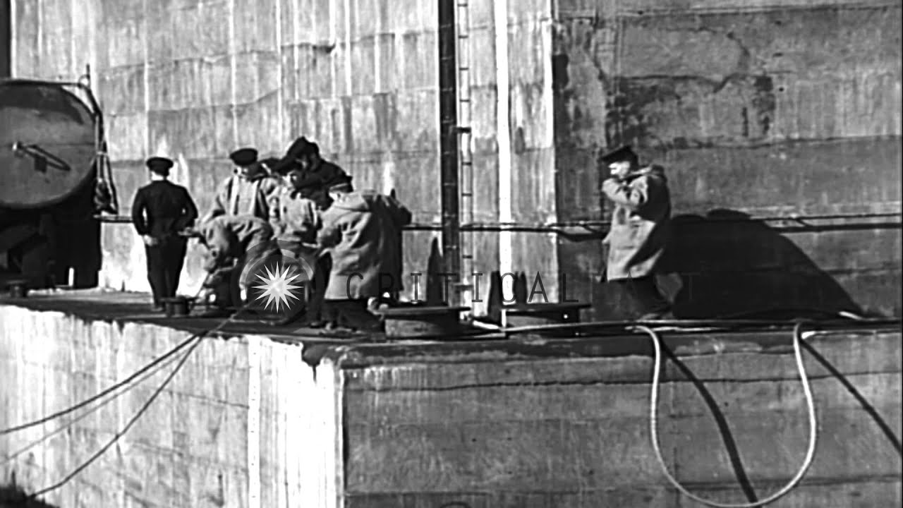 Tugs pull floating concrete caisson at Portsmouth harbor, England HD ...