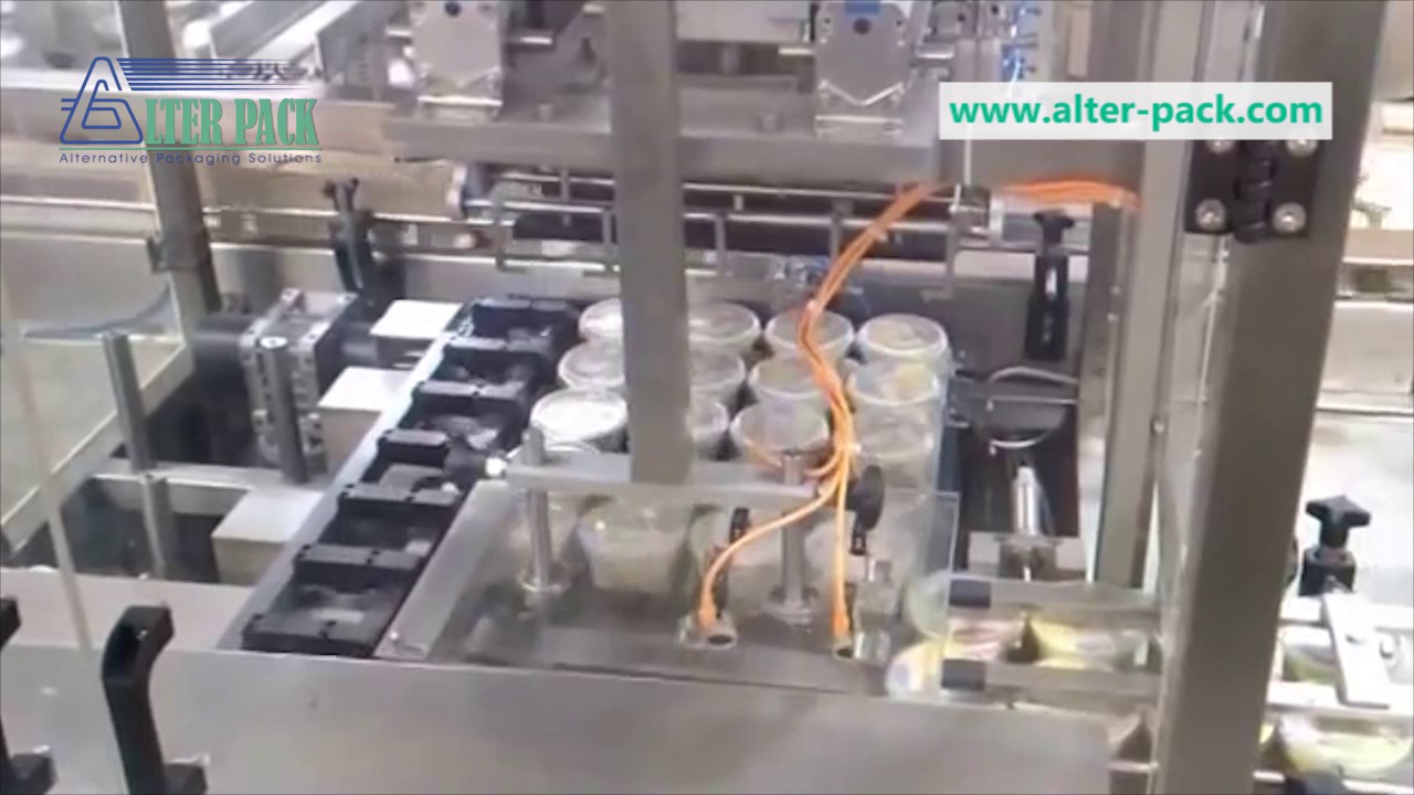 Tray loading system for any shape plastic containers - YouTube