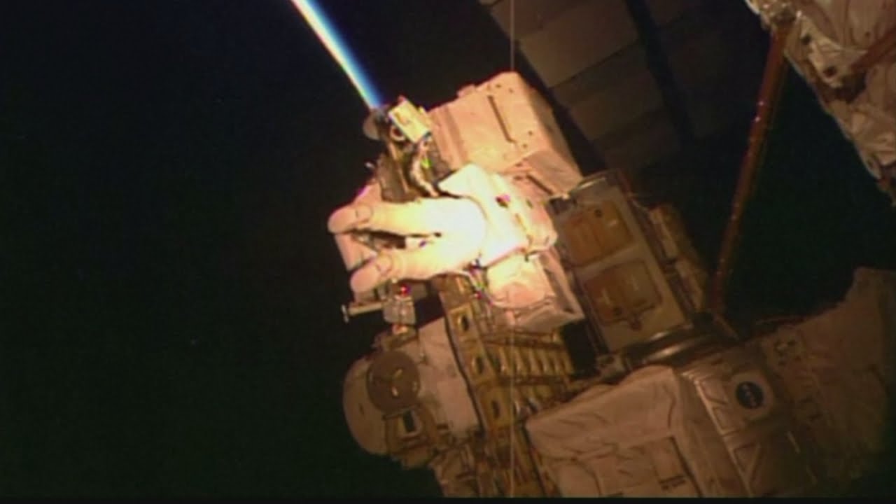 Astronauts spacewalk outside of the ISS - YouTube