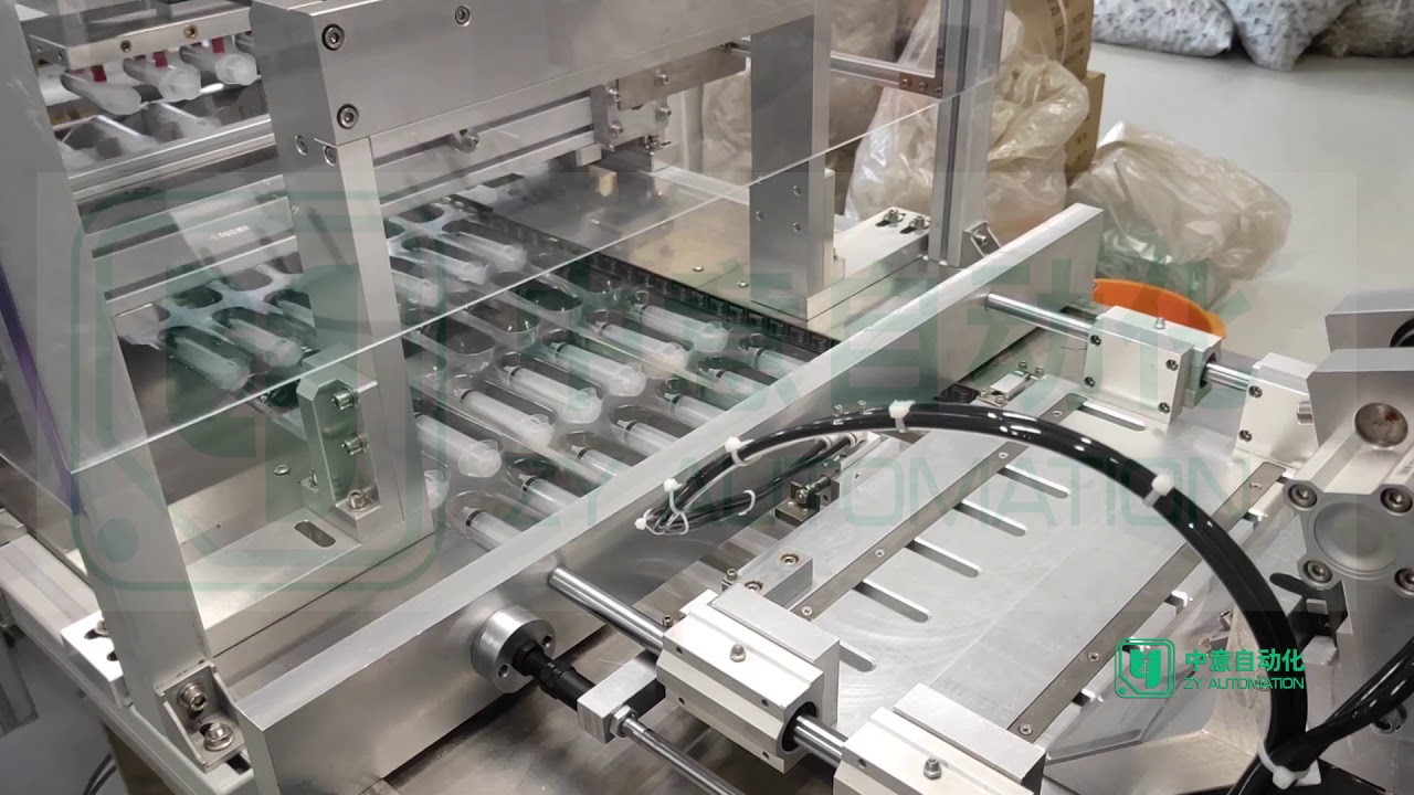 Hypodermic needle auto loading system - YouTube