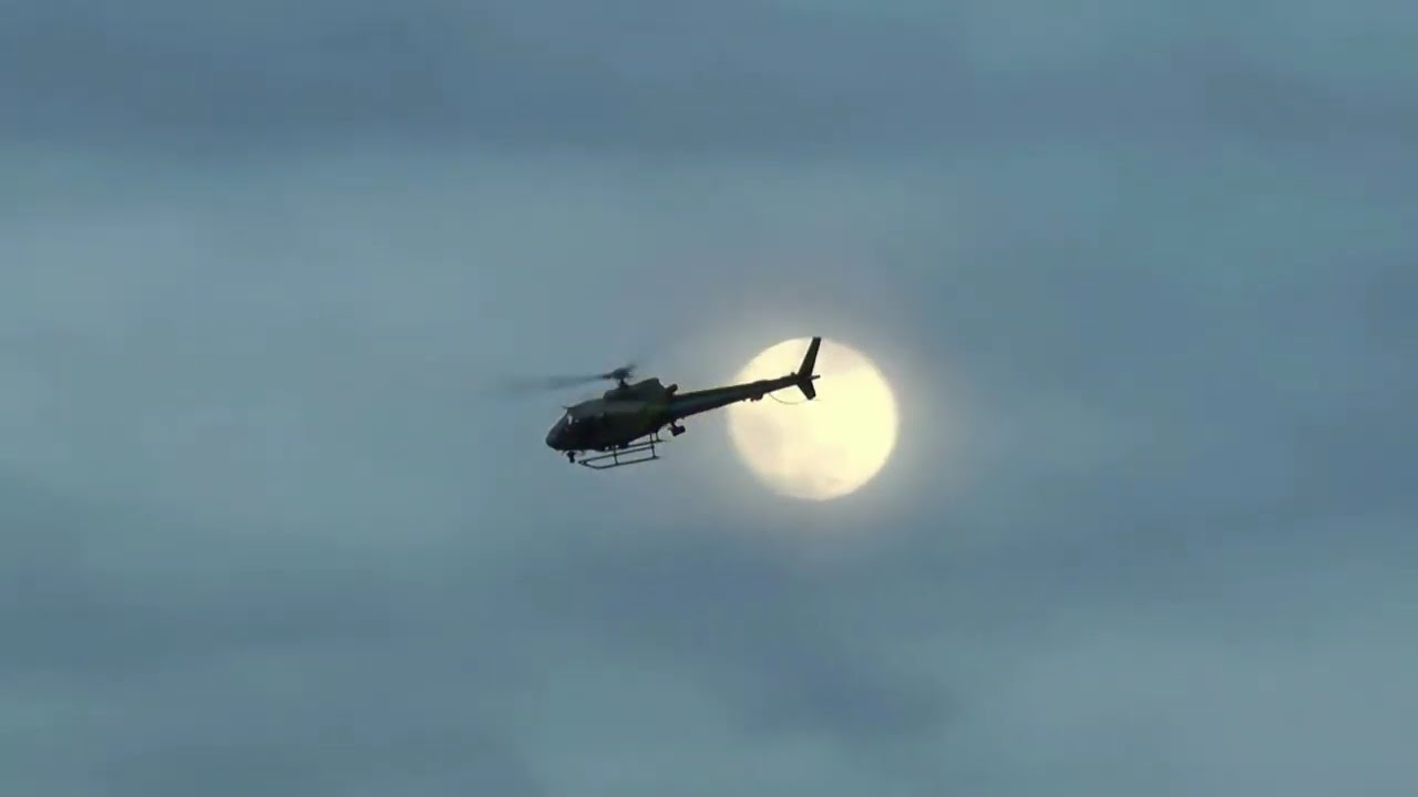Helicopter Flying by the Moon II - YouTube