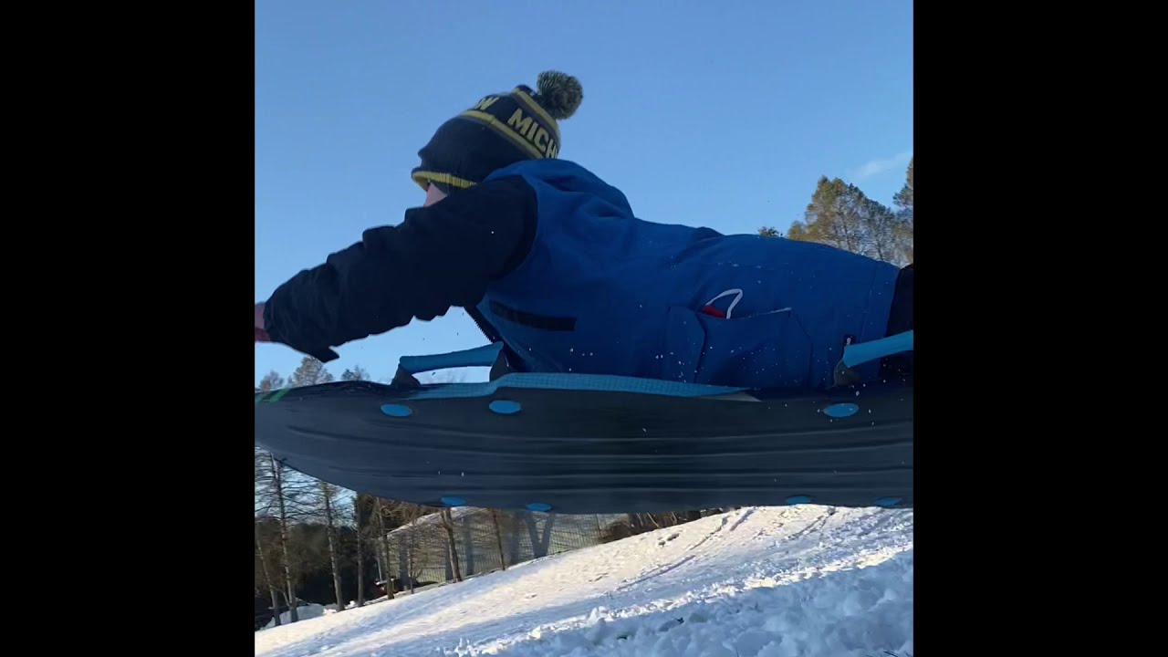 Sledding on a giant snow ramp! - YouTube