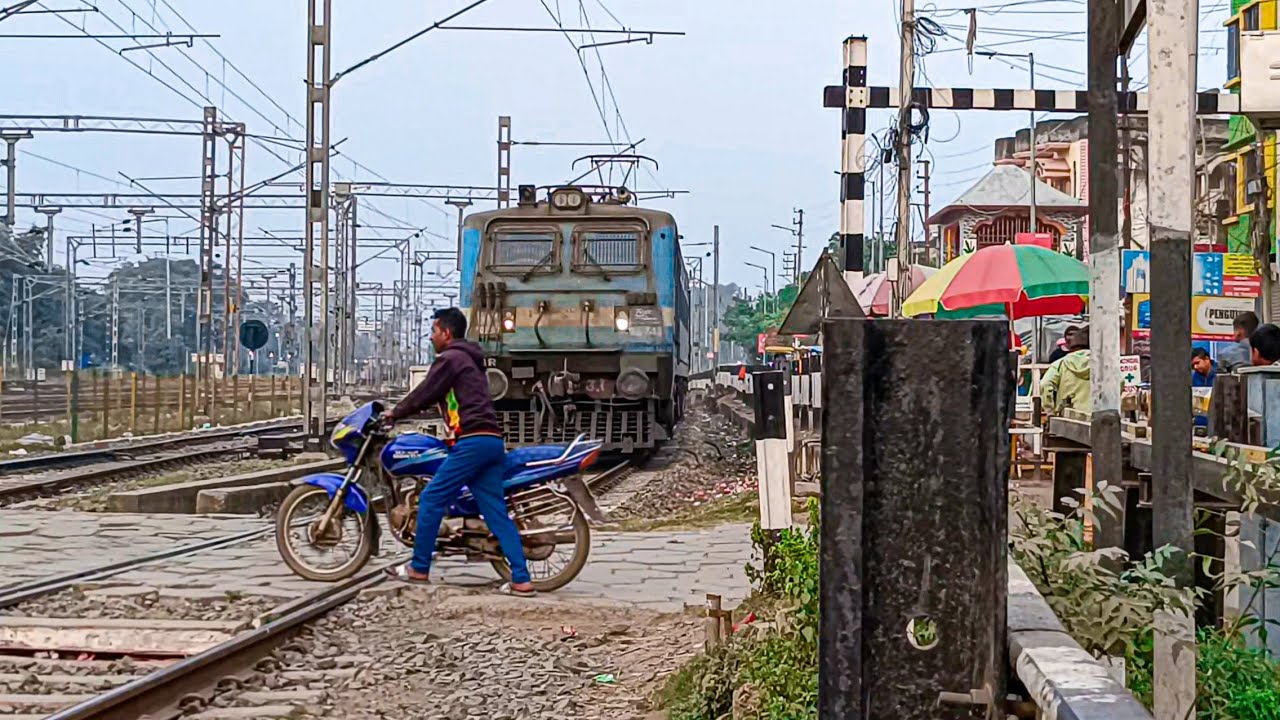 Careless peoples crossing railgate in front of the running train - YouTube