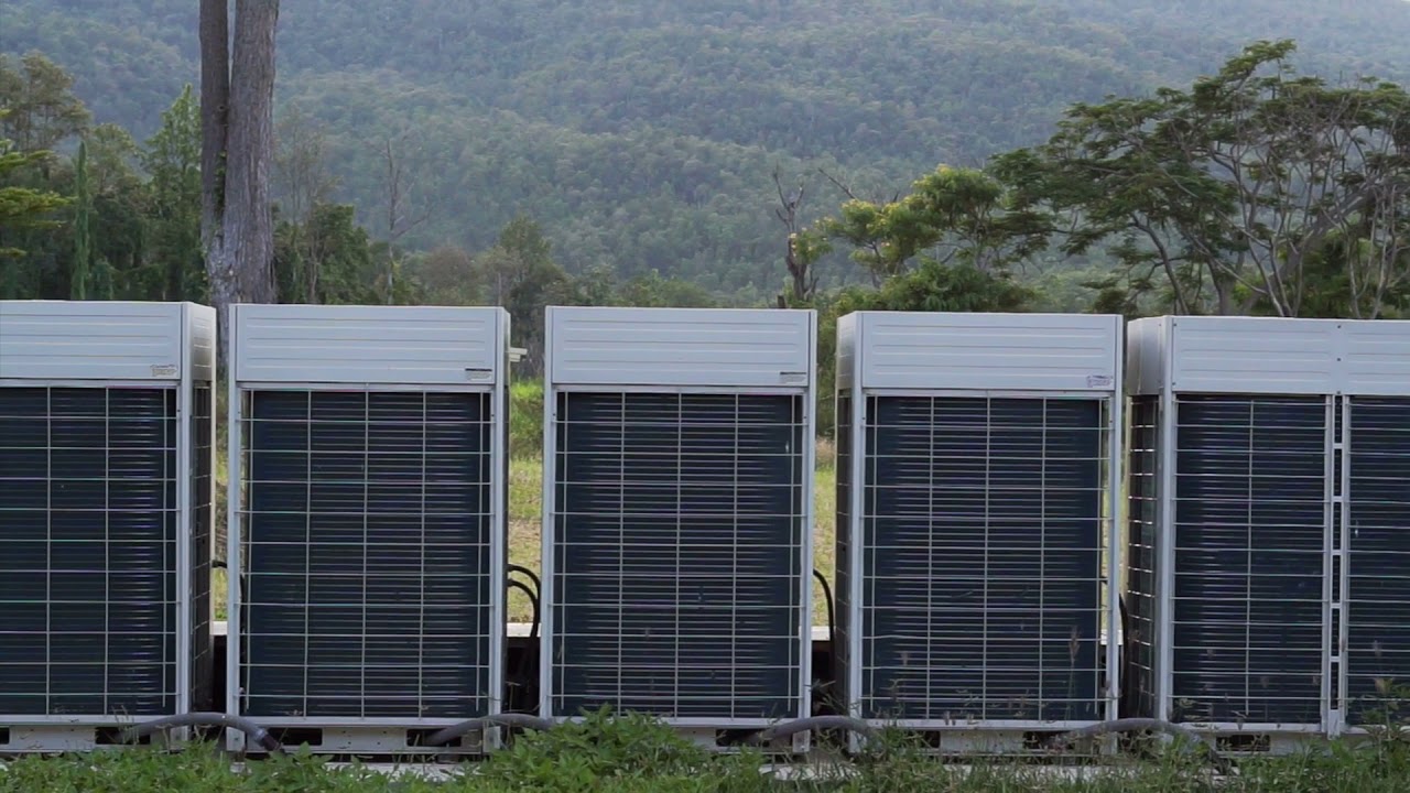 huge air conditioner outdoor units outside with mountain background ...