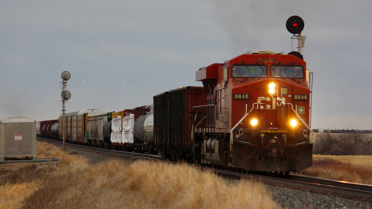 HUGE TRAIN!!! CP 8848 and CP 8634 lead CP 293 west departing Crowfoot siding, Alberta - YouTube