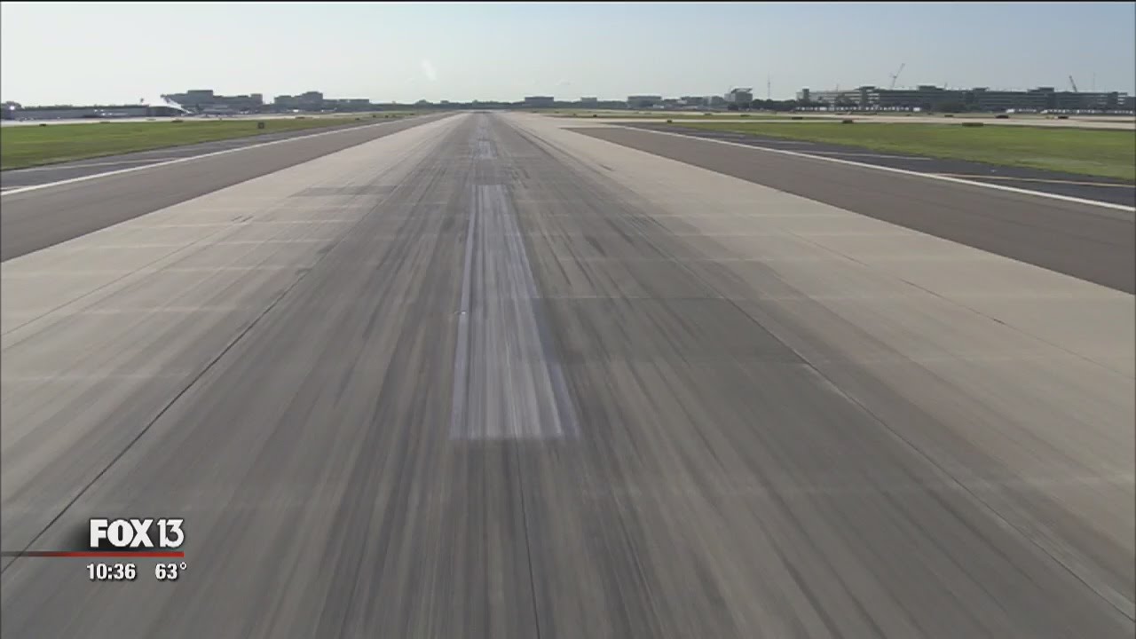 Employees blast rubber from Tampa Airport runways - YouTube