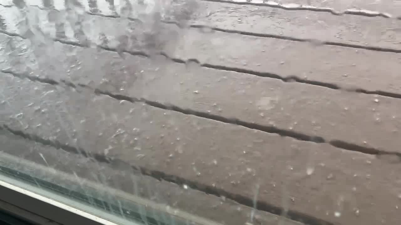 Hail picks up in size and intensity during a severe thunderstorm in Box ...