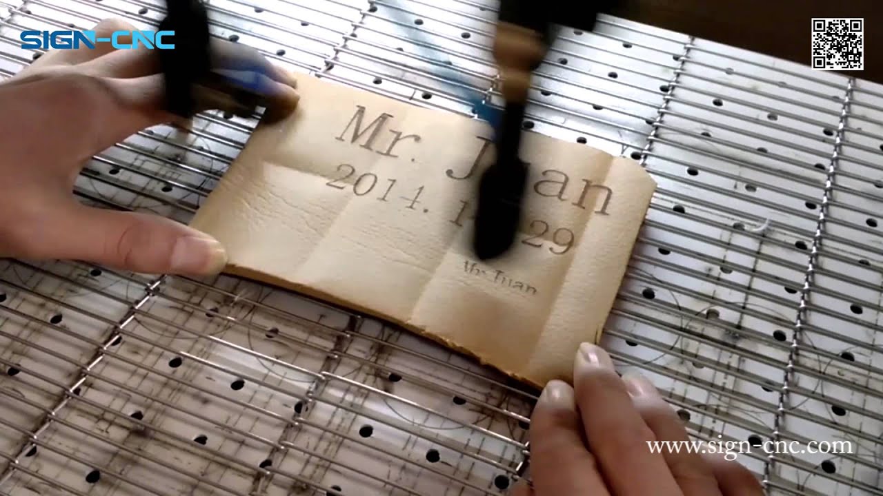 Laser engraving and cutting machine engraving on cardboard, paper board ...