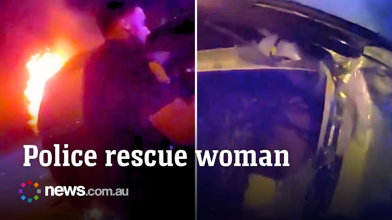 Police officers rescue woman from burning car after crash - YouTube