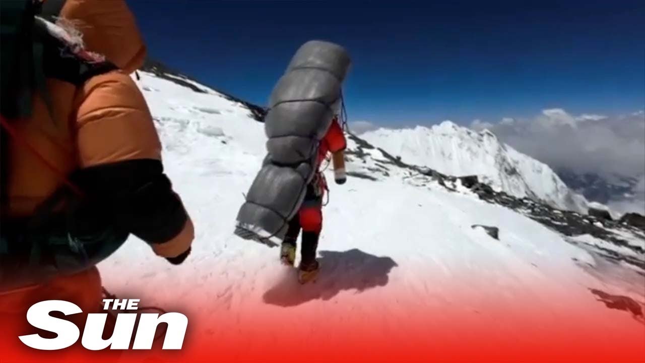 Sherpa carries distressed climber down Mount Everest 'death zone' - YouTube