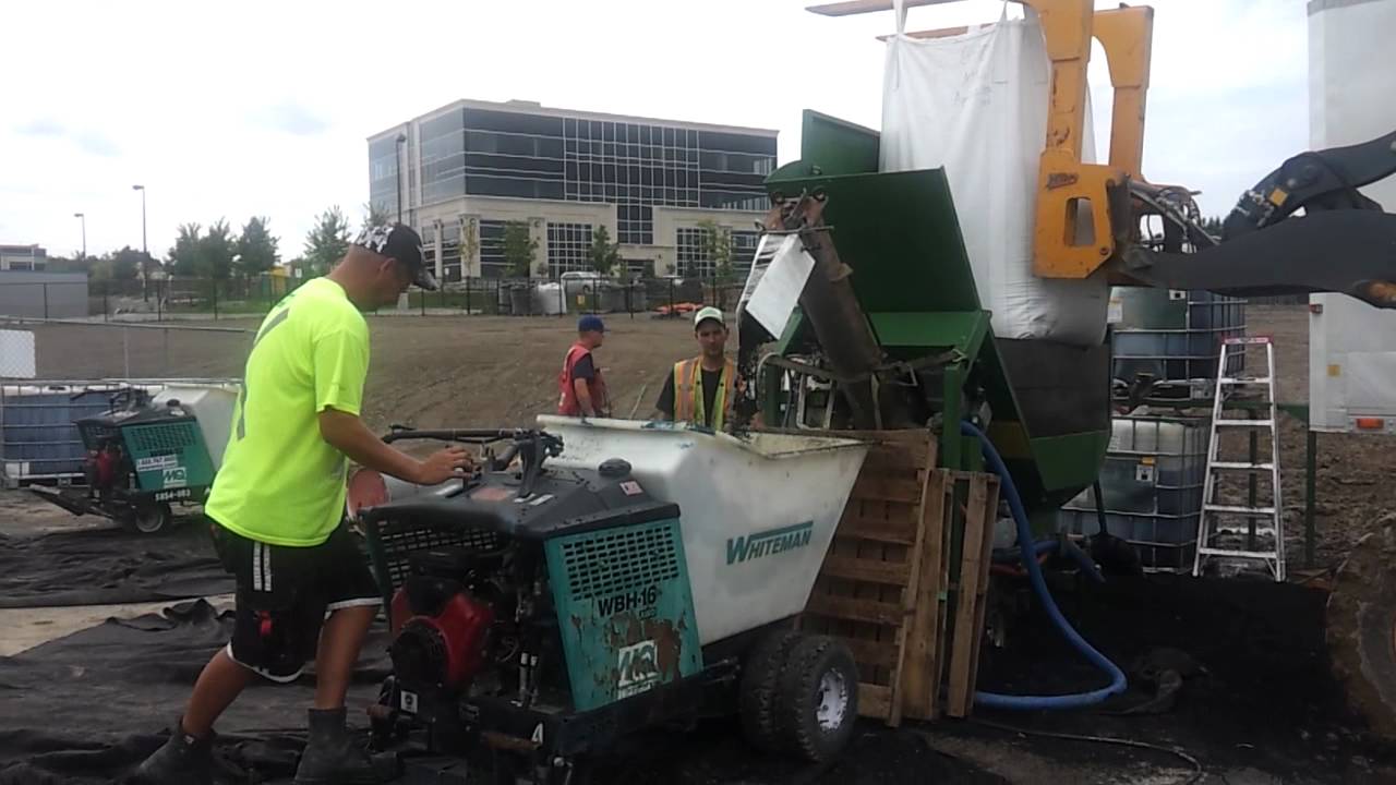 Rubber running track construction - YouTube