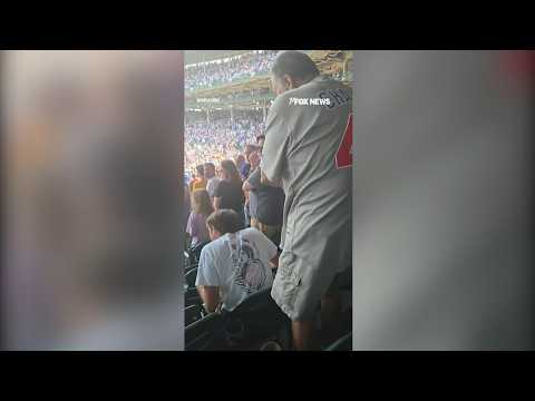 ‘Good on him’: Man goes viral for slapping young fan for not standing during National Anthem