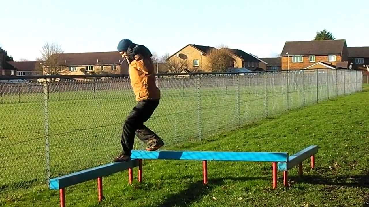 Balance beam walking with sandbag - YouTube