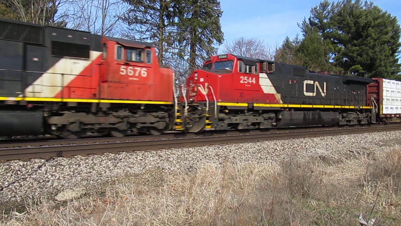 CN 2221, 5646, 5676, 2544 Westbound mixed freight car train at Vicksburg, MI - YouTube