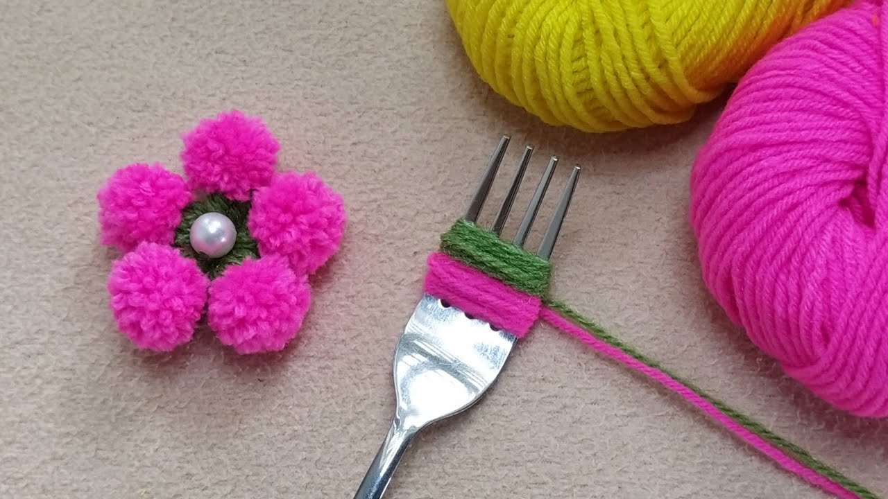 It is very easy !! Super easy Woolen Yarn Flower making idea with Fork ...