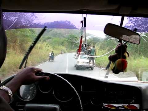 Overloaded compact car in the Central African Republic - YouTube