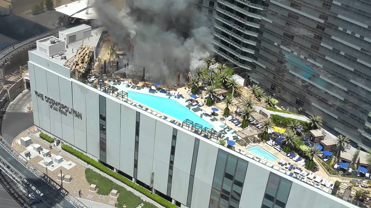 Firemen putting out Cosmo pool fire - YouTube