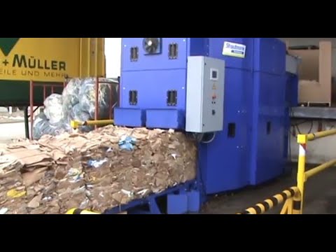 Compaction of cardboard in our BaleTainer. - YouTube