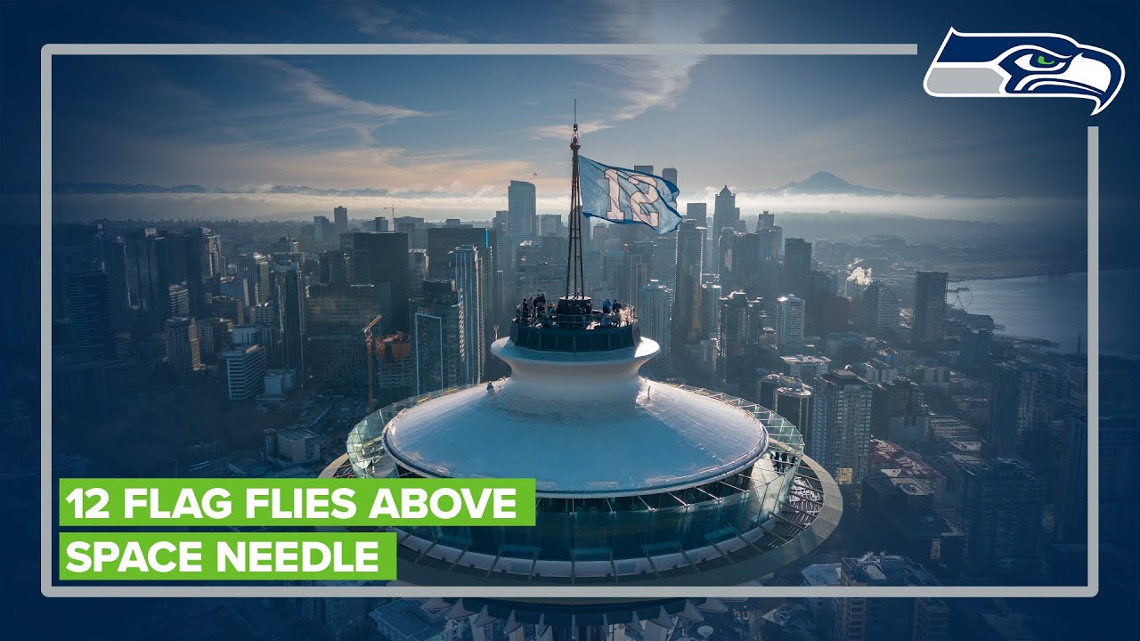 12th Man flag flies above Seattle ahead of Seahawks game - YouTube