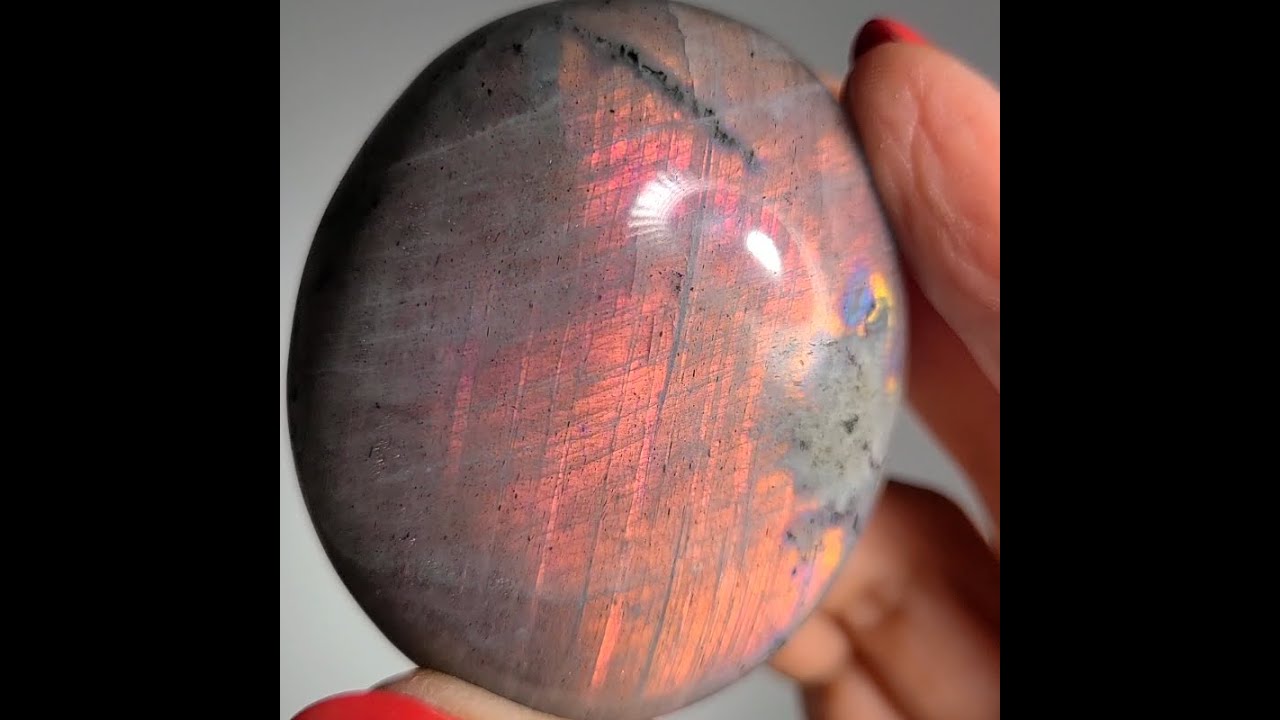 Pink and rose flash labradorite palm stone - YouTube