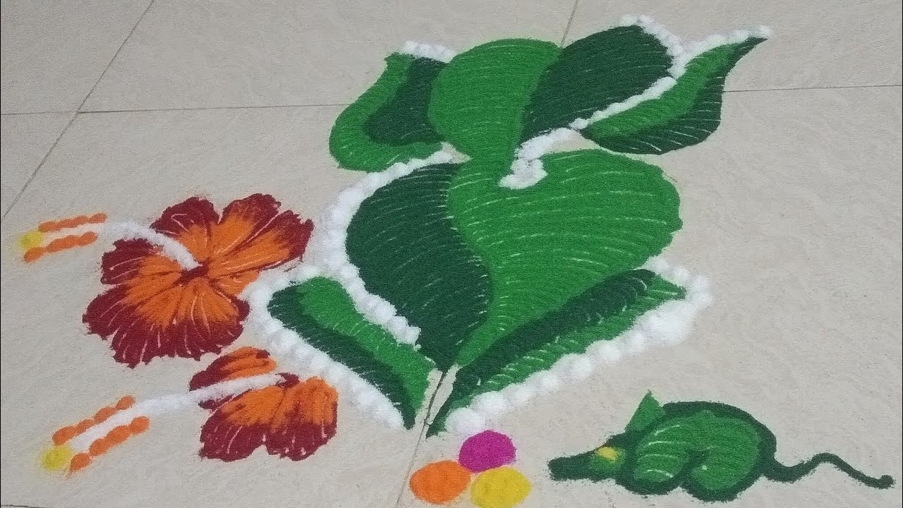 Leaf Ganesha rangoli with hibiscus flowers | - YouTube