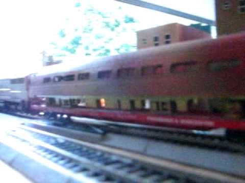 runby of the weathered Amfleet car HO Scale lead by Athearn INRD SD60 ...