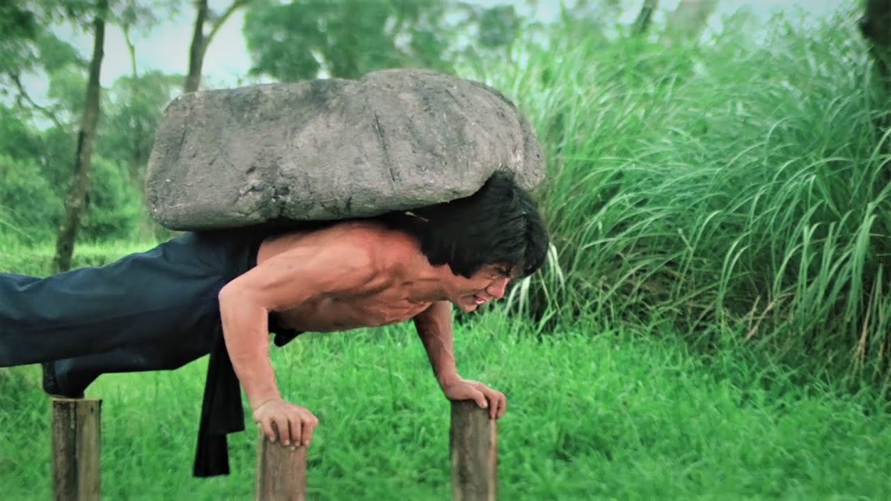 A weak boy does pushups with a 300 kg rock to mold his shoulder ...
