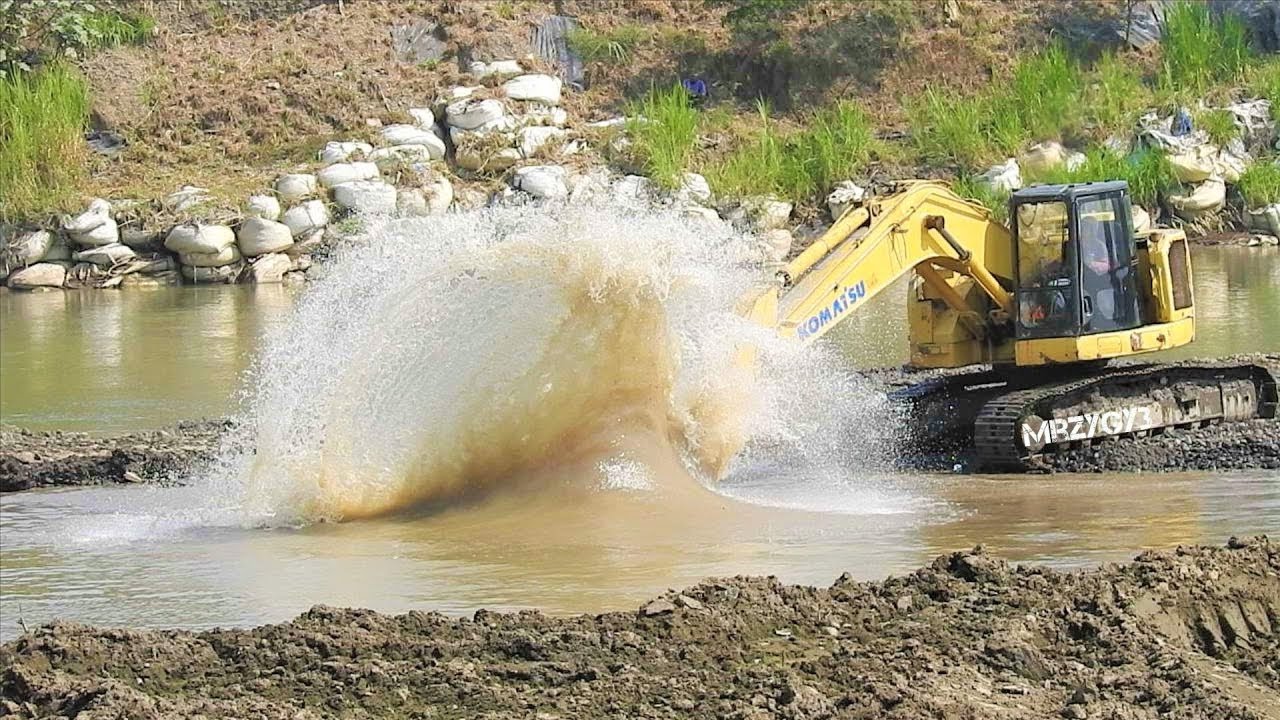 Excavator And Crane Working On River Dam Construction - YouTube