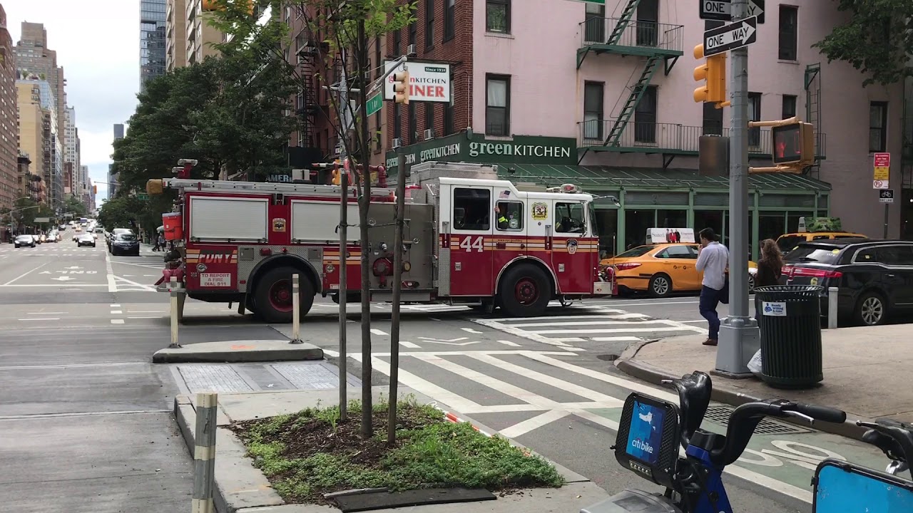 FDNY ENGINE 44 TAKING UP FROM A CALL ON EAST 77TH STREET ON THE EAST ...