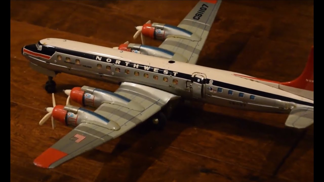 Tin toy plane from 60s works - YouTube