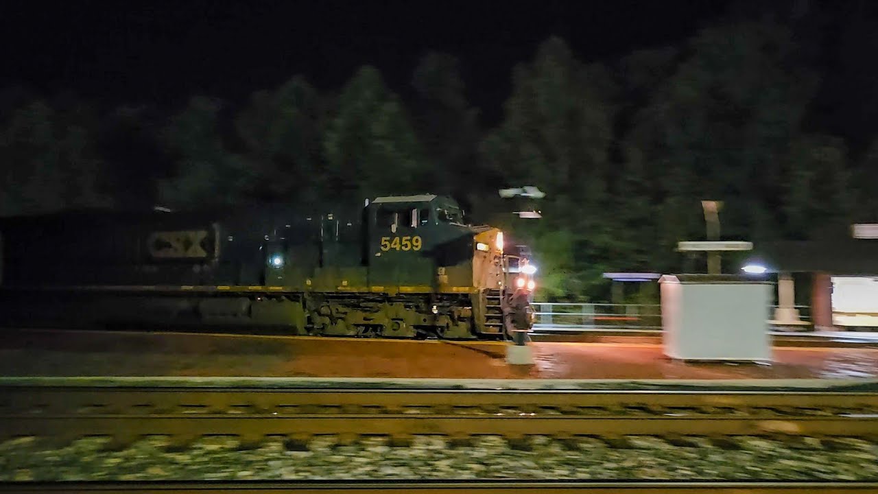 The Old Main Guy and the Horseless Headsman watch a CSX mixed freight ...