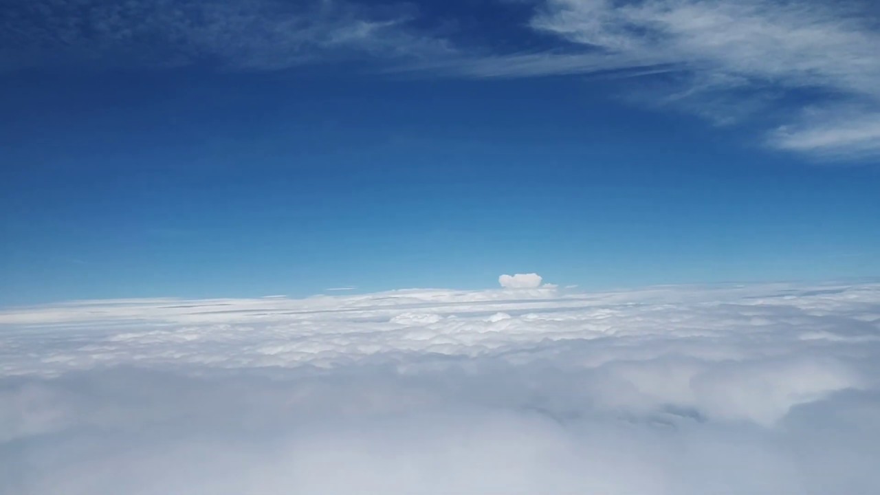 Plane between two layers of clouds what a wonderful view - YouTube