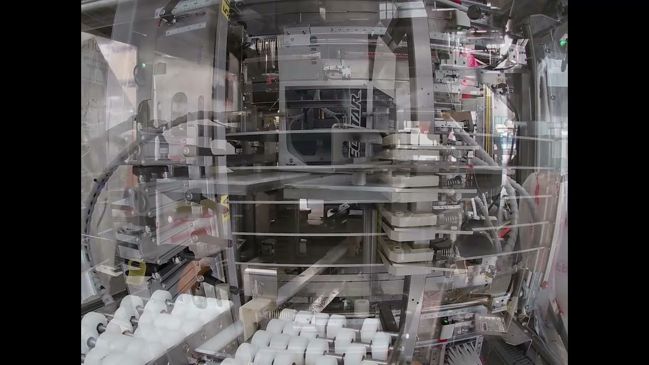 Oil bottle packing with the Standard-Knapp Versatron - YouTube