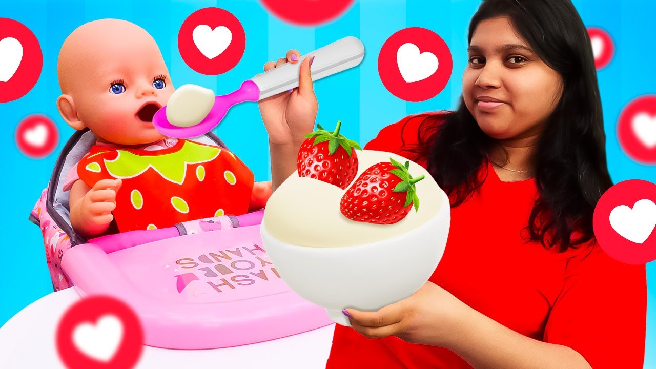 Cooking baby food for the baby born doll. Feeding baby doll in a new ...