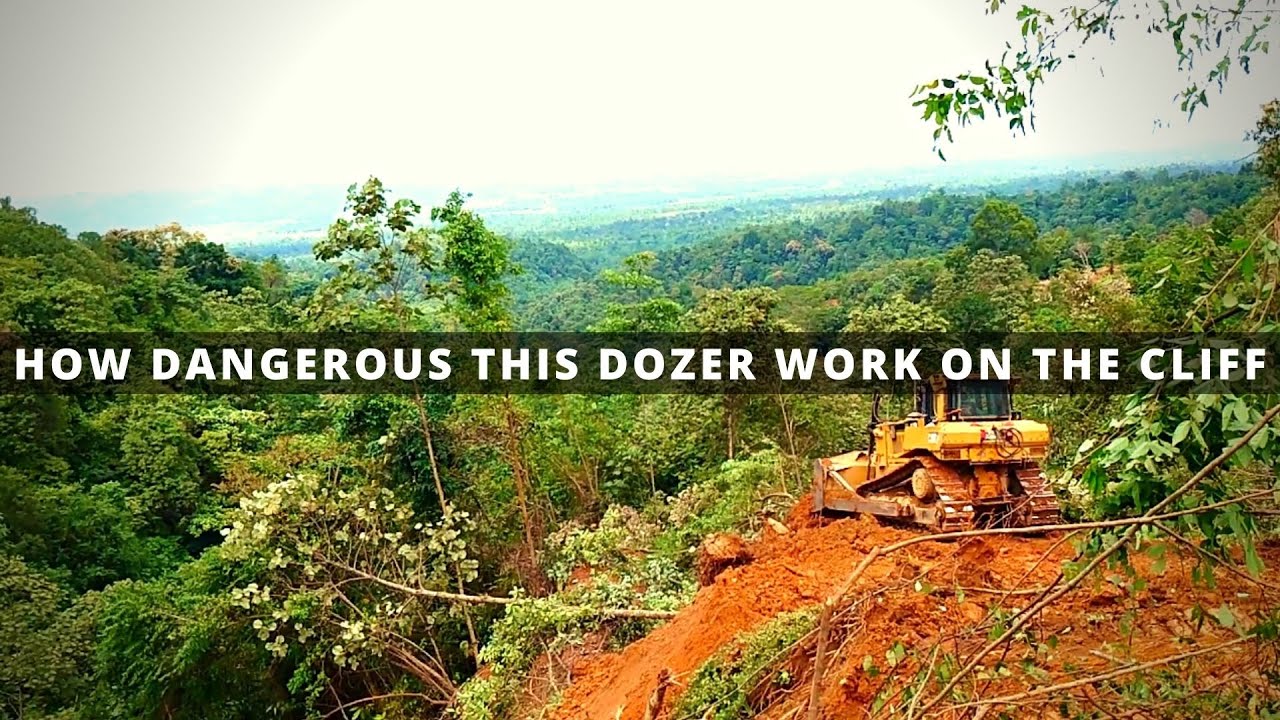Dozer Clears The Bushes On The Edge Of The Cliff - YouTube